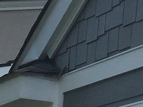 Rake aluminum trim on house ( recently installed ) is buckled