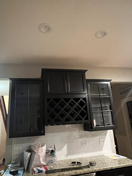 How to take my staggered cabinets to the 9ft ceiling?