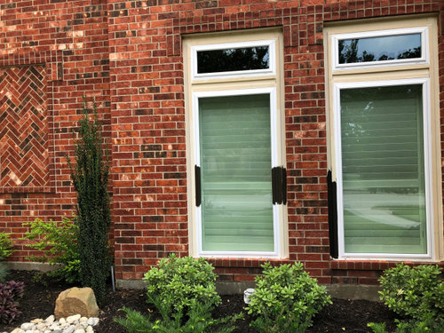 Black windows with red brick