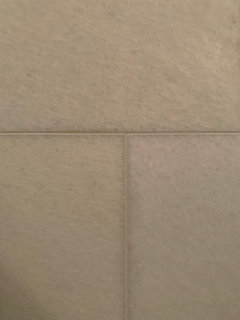 Grout bleeding into marble tiles