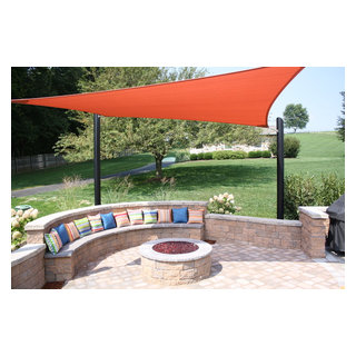 Sail shade over a paver patio and a gas firepit - Patio - Philadelphia ...
