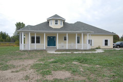 What color shutters go with a light yellow house?