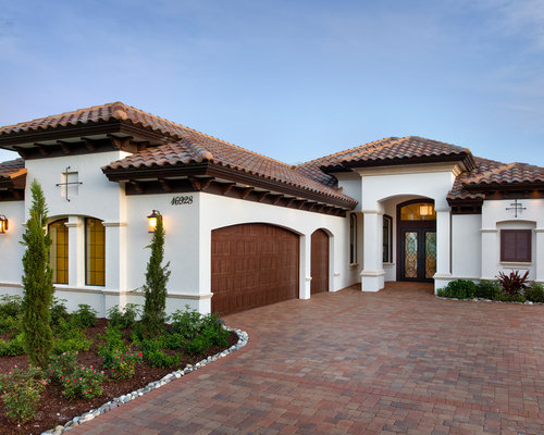 Mediterranean Exterior Design Ideas, Remodels & Photos with a Hip Roof