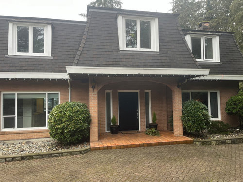 Help with ideas to update this 1970s brick and mansard roof home ...