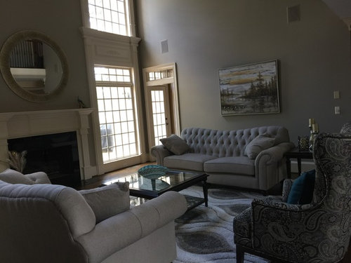 Wall decor for a huge wall with an off center sofa