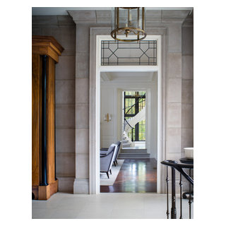 Limestone Entry Foyer with Transom and Floating Staircase View ...