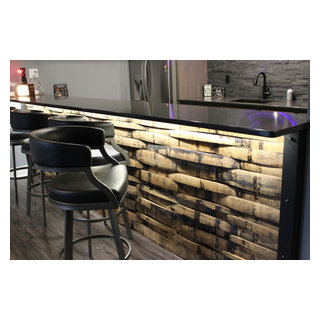 Lower Level Bar With Whiskey Barrel Planks, Gray Cabinets, and Black ...