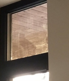 White haze on brand new sliding glass door