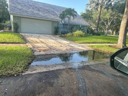 How to fix this? pooling water at end of driveway