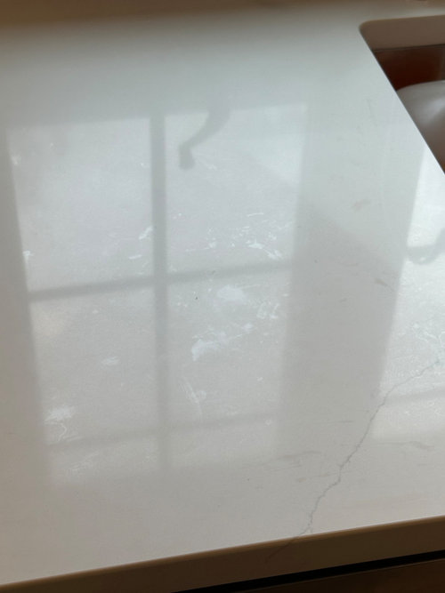 Brand new white Viatera quartz countertops have streaks allover them