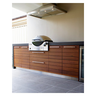 Outdoor Kitchen with a polished concrete benchtop & hardwood doors ...