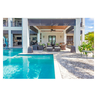 Resort-Style Poolside Patio with Covered Lounge and Rattan Seating ...
