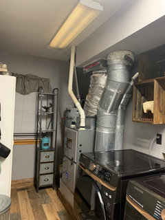 How can I hide this unseemly HVAC unit in my laundry room?