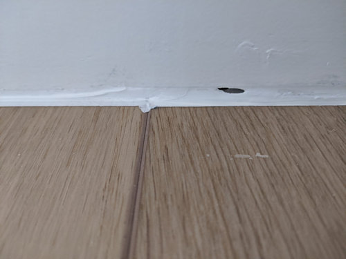 baseboards with vinyl flooring