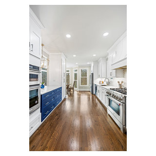 Galley Kitchen with Bold Blue Island and White Shaker Cabinets ...