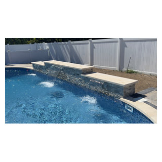 Unilock XL smooth Almond Grove Pool Patio with Travertine Waterfalls ...