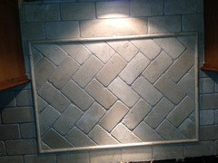 Backsplash recommendations for black fantasy leathered granite?