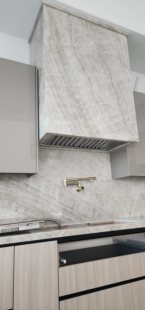 Will quartzite wrapped range hood fall off?