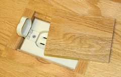 Where do I put electric floor plugs in living room?