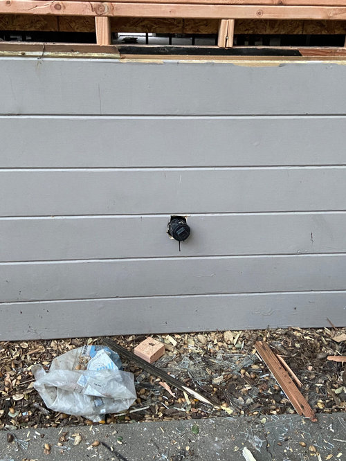 Kitchen sink cleanout exposed outside the exterior wall