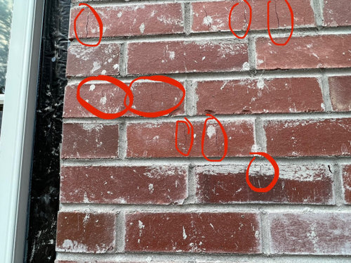 Hairline cracks in brick - new build