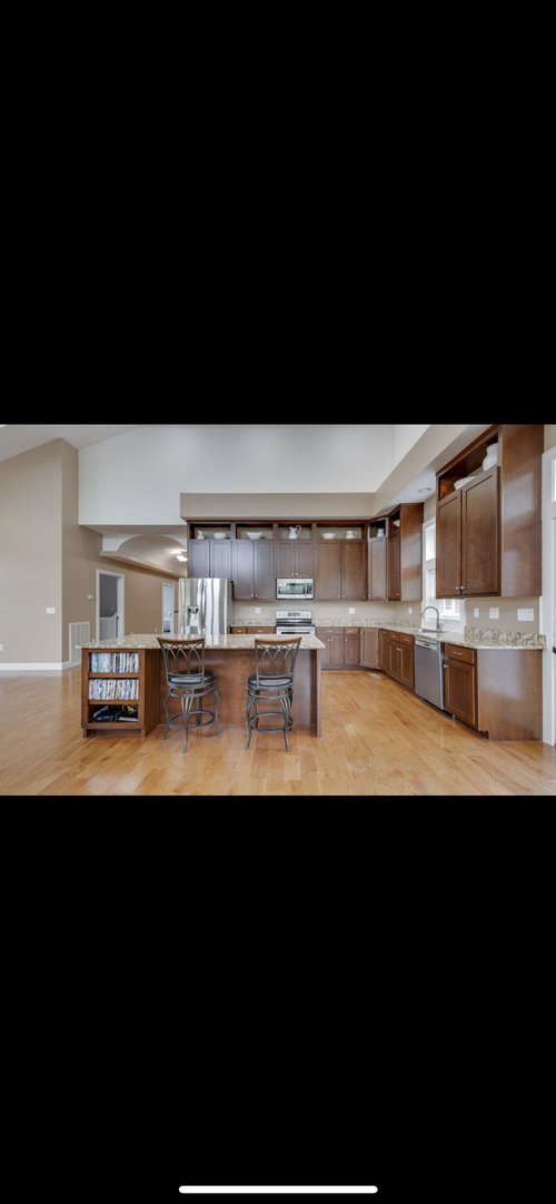 What do I place between the refrigerator and range?