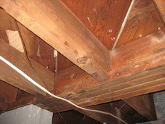 Replace ledger strip with joist hangers (floor joist support)