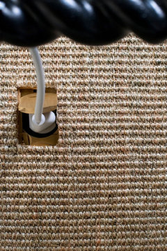 Cut a hole for plug in new Rug?