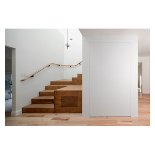 Bottom of stair with hidden pivot door closed. - Modern - Staircase ...