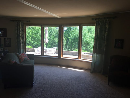 Curved wall of windows in dining/living room combo
