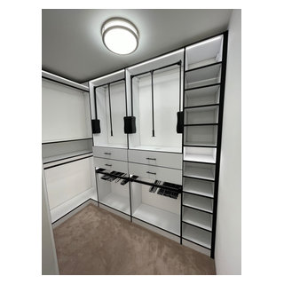 Contrasting Elegance: Custom White Walk-In Closets with Bold Black ...