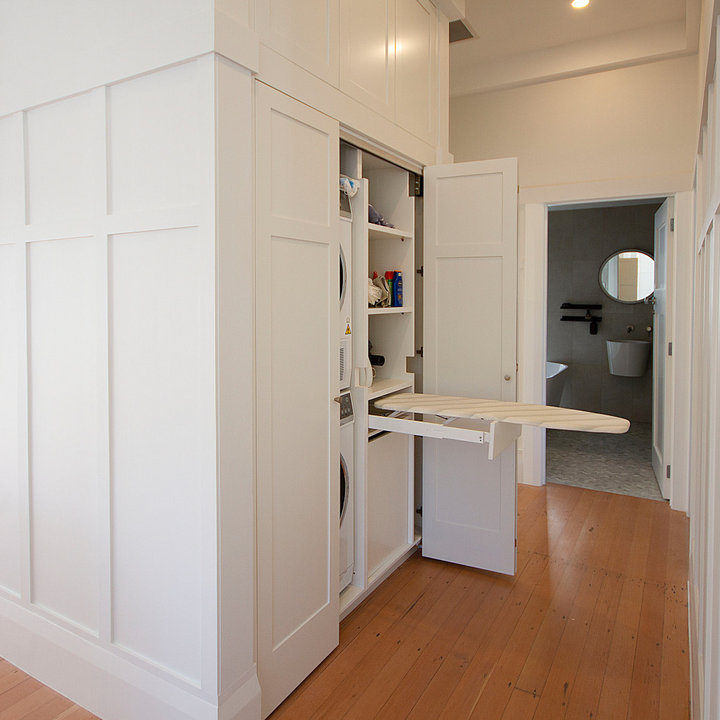 75 Beautiful Utility Room with a Stacked Washer and Dryer Ideas and ...