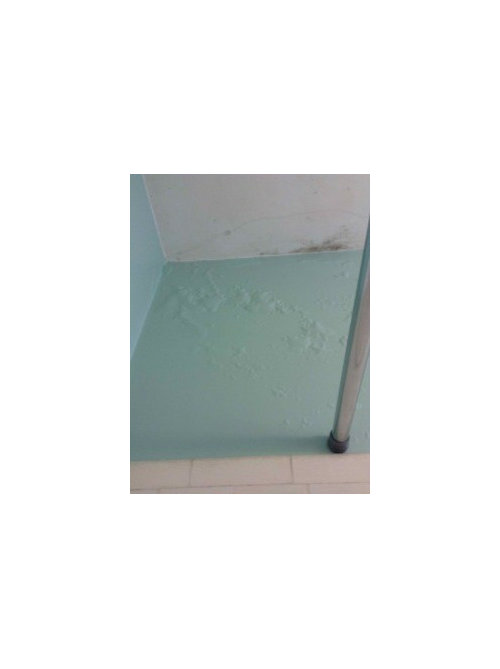 What caused the water damage to the bathroom ceiling?