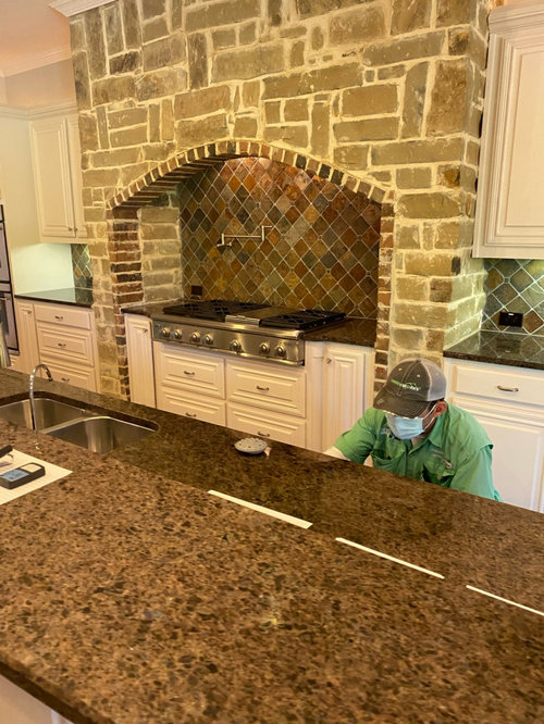 How to modernize a kitchen with stone arch over stove?