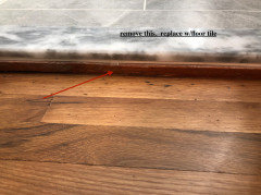 Chipped tile at door threshold in new bathroom. What to do?