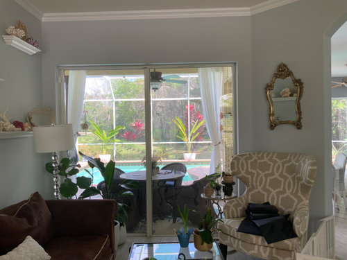 Fixed drapery panels for narrow wall space.