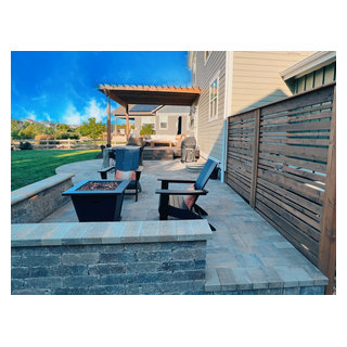 Combination backyard project featuring deck, pergola, and patio pavers ...
