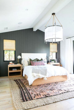 Asymmetrical window on bedroom wall