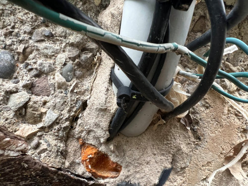 Best way to waterproof hole for electrical wires in exterior concrete