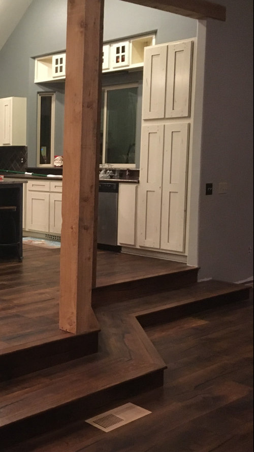 Sunken living room step riser flush with wall. How to install trim?