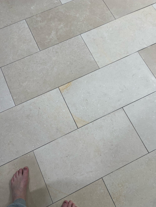 Help! Limestone tile staining while it is being installed