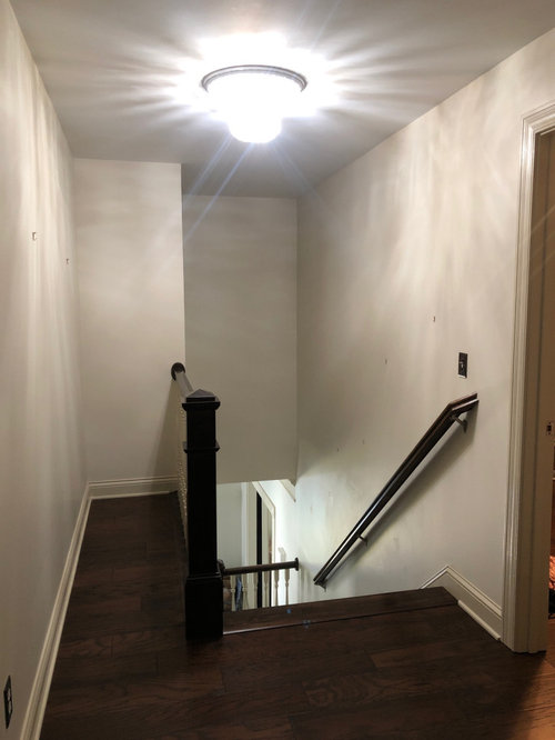 Narrow space at top of stairs