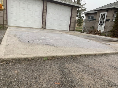 New concrete driveway is sagging and leaves a big puddle of water