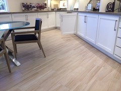 Help! Sharp edges on floor tiles after install.