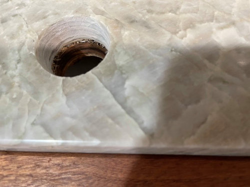 There is a crack where the whole was drilled for my faucet quartzite ...