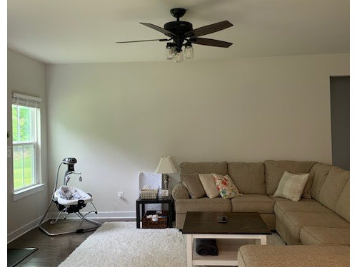 Decor for large wall with couch off centered?