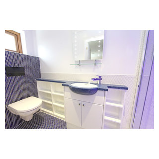 Plenty of storage in the open shelving and under basin furniture ...