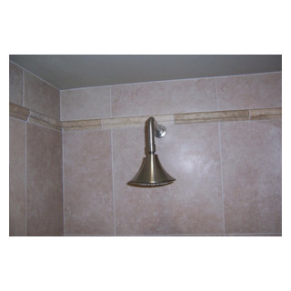 Porcelain wall tile with travertine detail at crown and window wrap ...