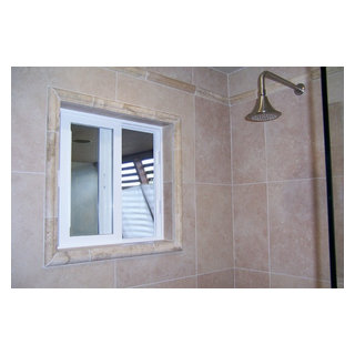 Porcelain wall tile with travertine detail at crown and window wrap ...