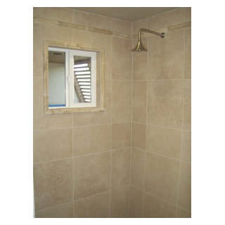 Porcelain wall tile with travertine detail at crown and window wrap ...